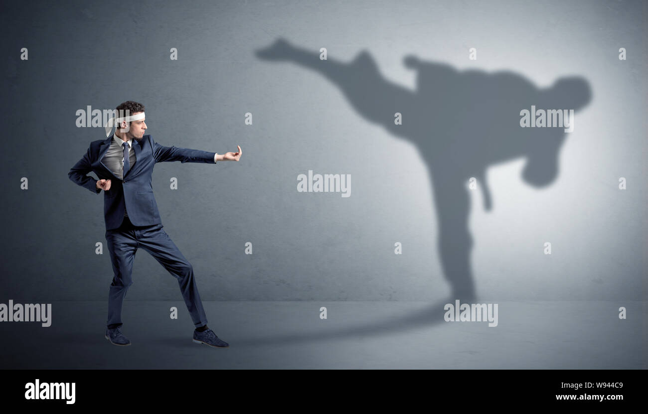 Young karate man confronting with his own shadow Stock Photo - Alamy