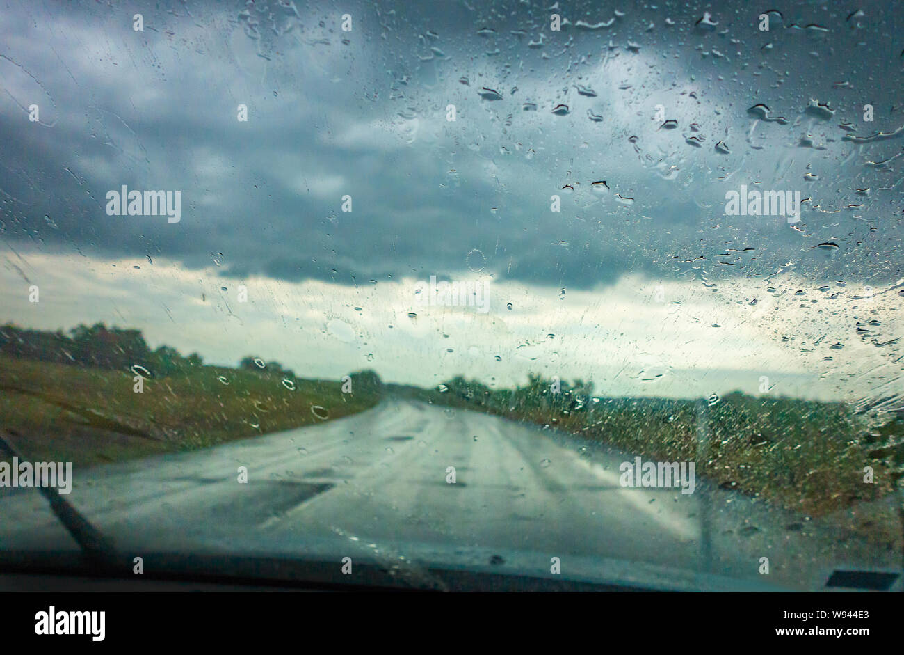 drivers view of heavy rain through car window Stock Photo - Alamy