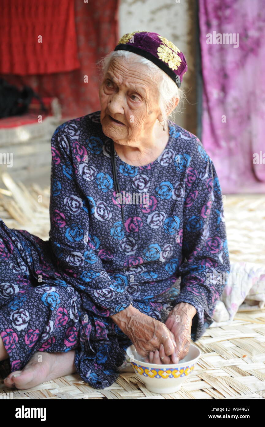 Chinese Uighur woman Ali Mihan, 127 years old, is pictured washing her ...