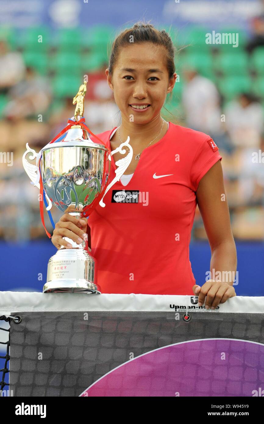 Chinese professional tennis player Zhang Shuai displays her trophy ...