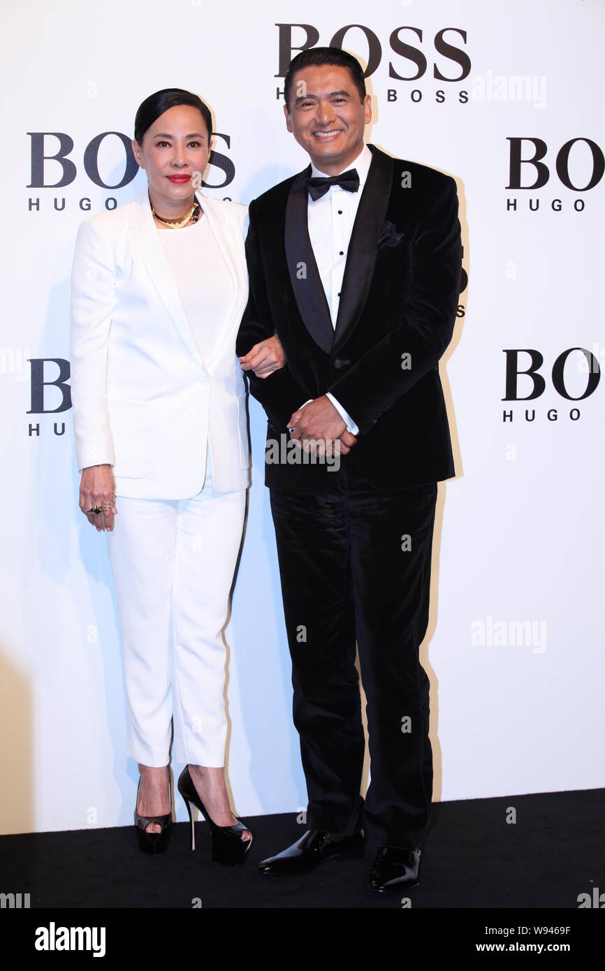 Hong Kong Actor Chow Yun Fat Right And His Wife Jasmine Tan Pose As They Arrive For A Fashion