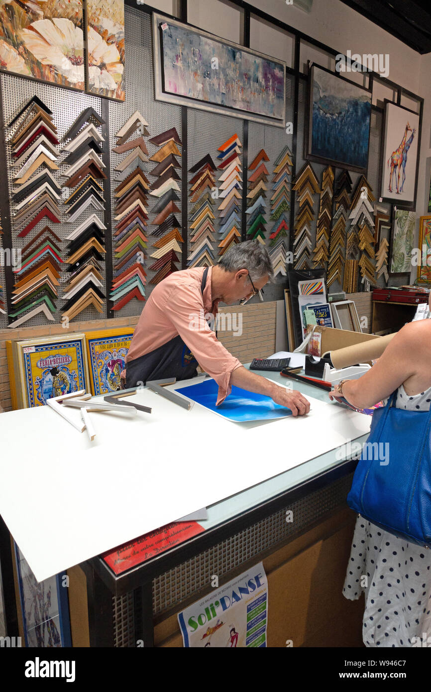 Lady picking picture frame hi-res stock photography and images - Alamy