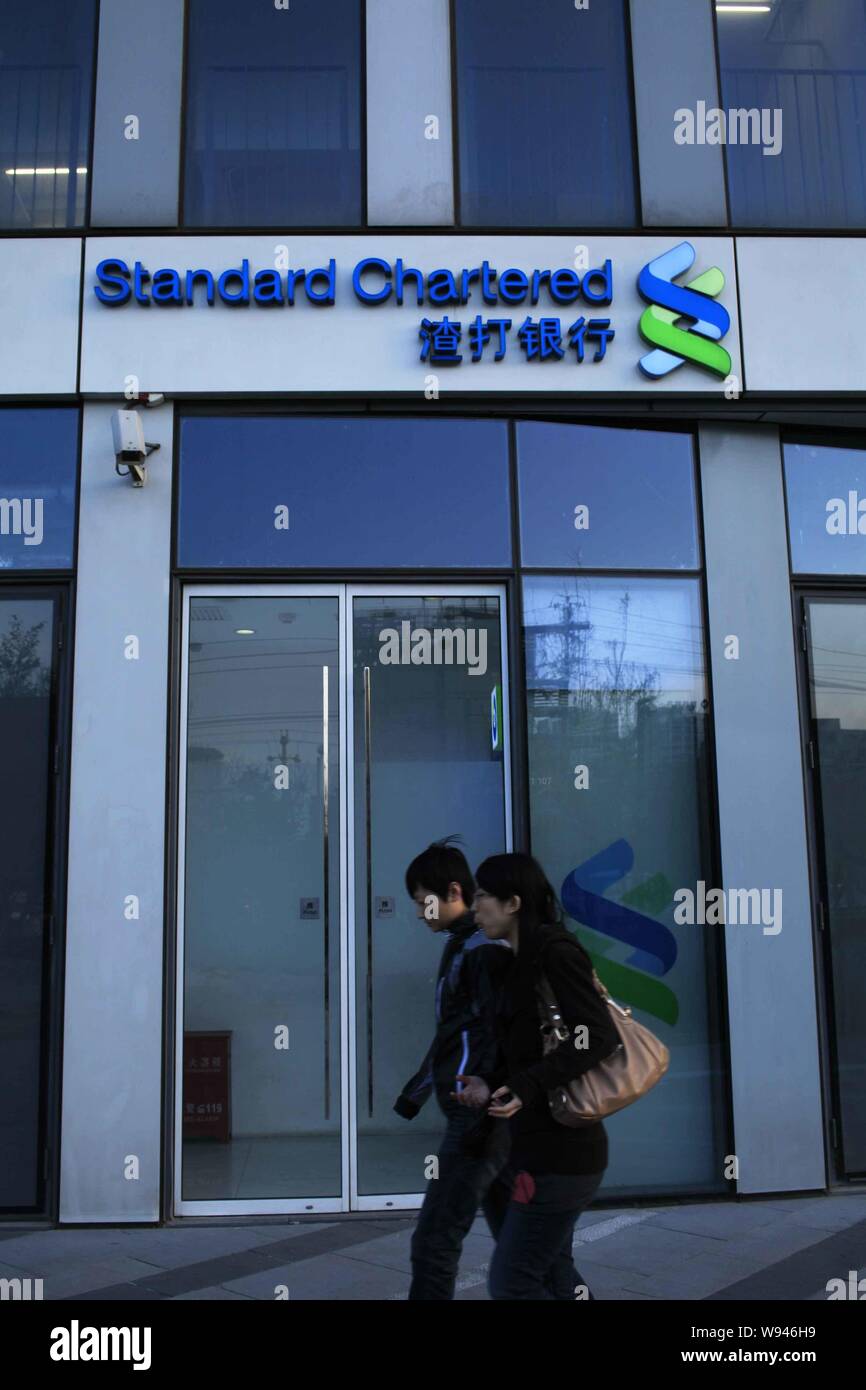 --FILE--Pedestrians walk past a branch of London-listed Standard ...
