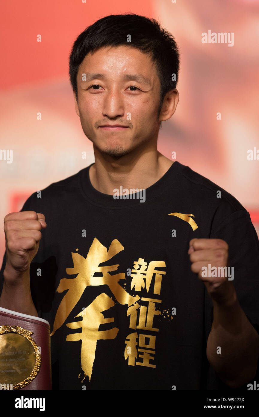 Chinese Olympic boxing champion Zou Shiming poses at a press conference ...