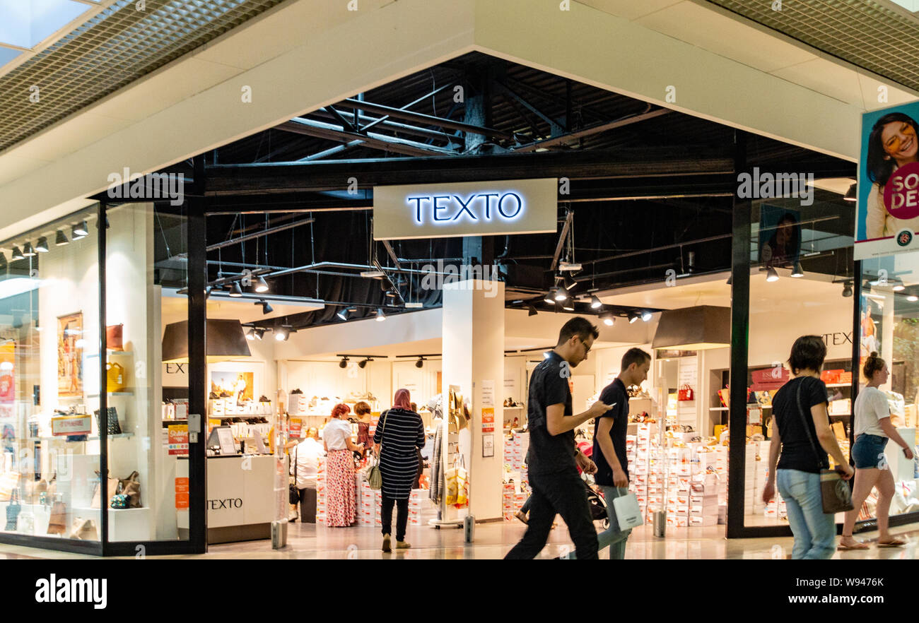 Customers walking and looking at shops in a French shopping Mall Stock ...