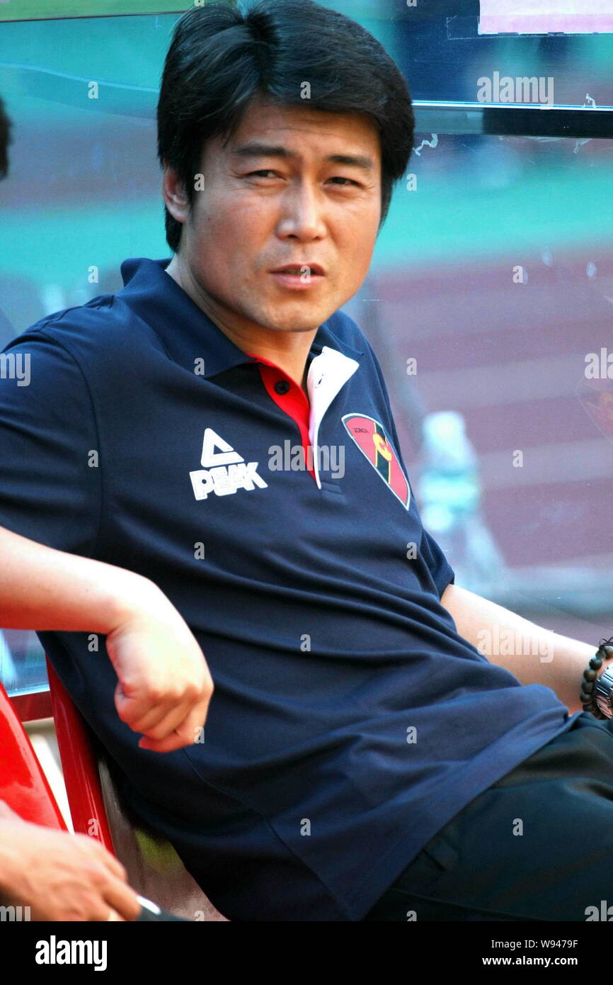 --FILE--Shen Si, head coach of Shanghai Zhongbang FC, watches the 9th ...