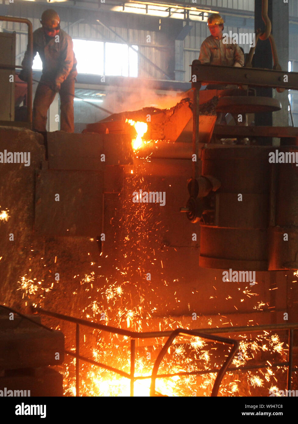 --FILE--Chinese workers produce steel at a steel plant in Nantong city ...