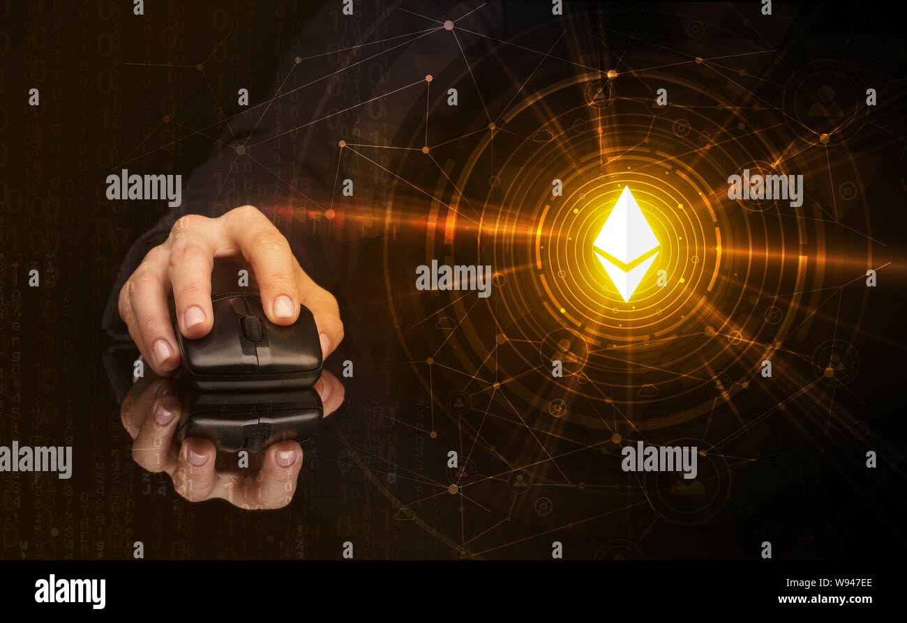 Hand using wireless mouse with cryptocurrency concept on dark ...
