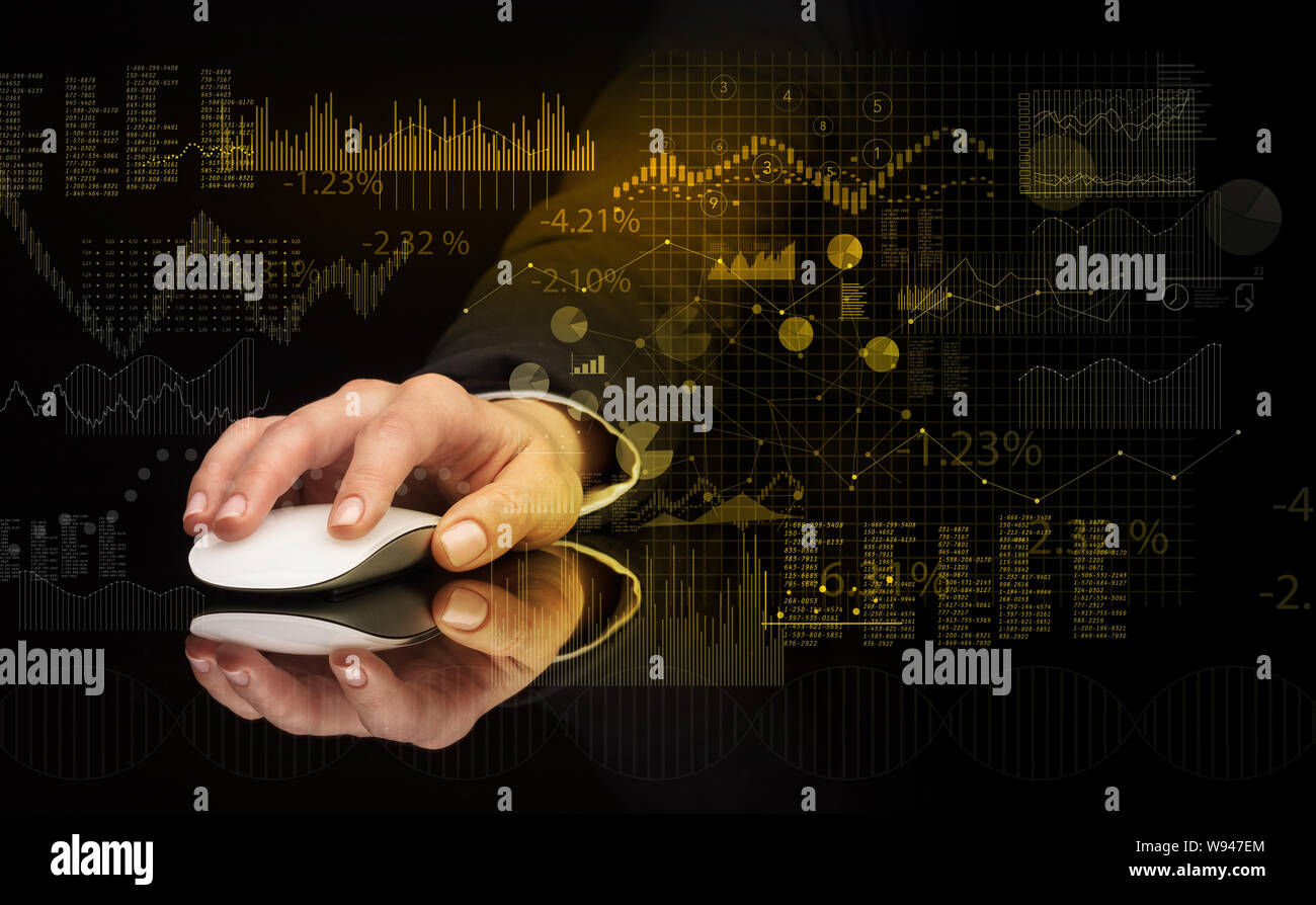 Hand using wireless mouse with financial concept on dark background ...