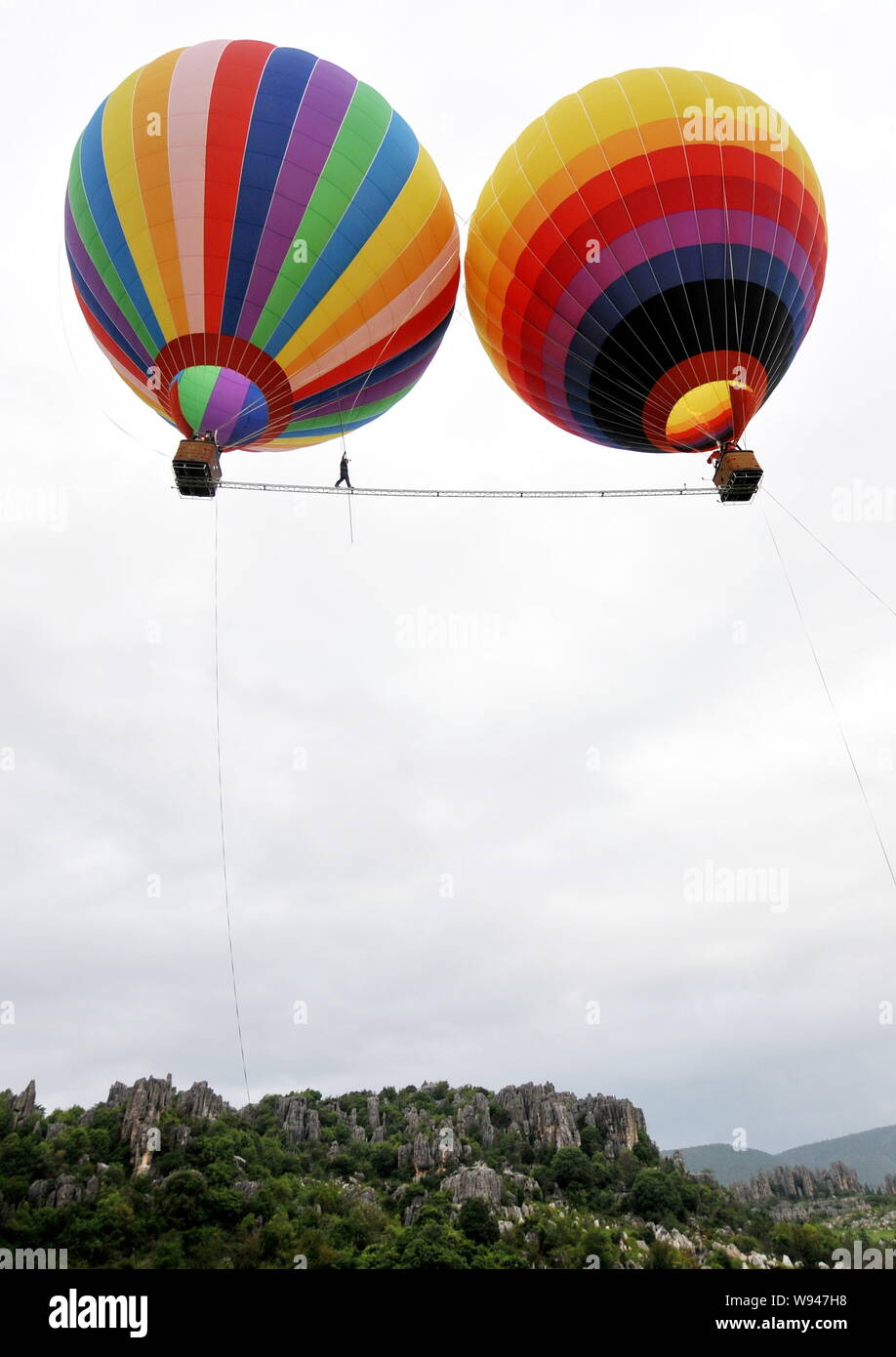 Chinese Uighur tightrope walker Aisikaier Wubulikaisimu walks on a ...