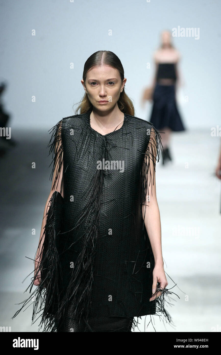 A model displays a new creation by Chinese designer Qiu Hao at his ...