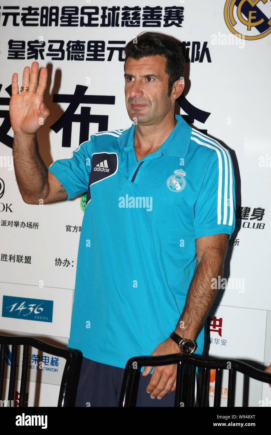 Portuguese football star Luis Figo of Real Madrid Leyendas waves during ...