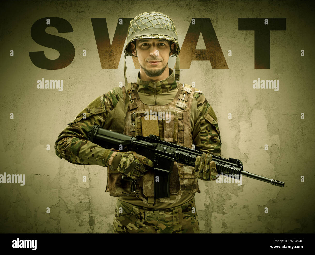 Uniformed armed soldier with damaged wall background Stock Photo - Alamy