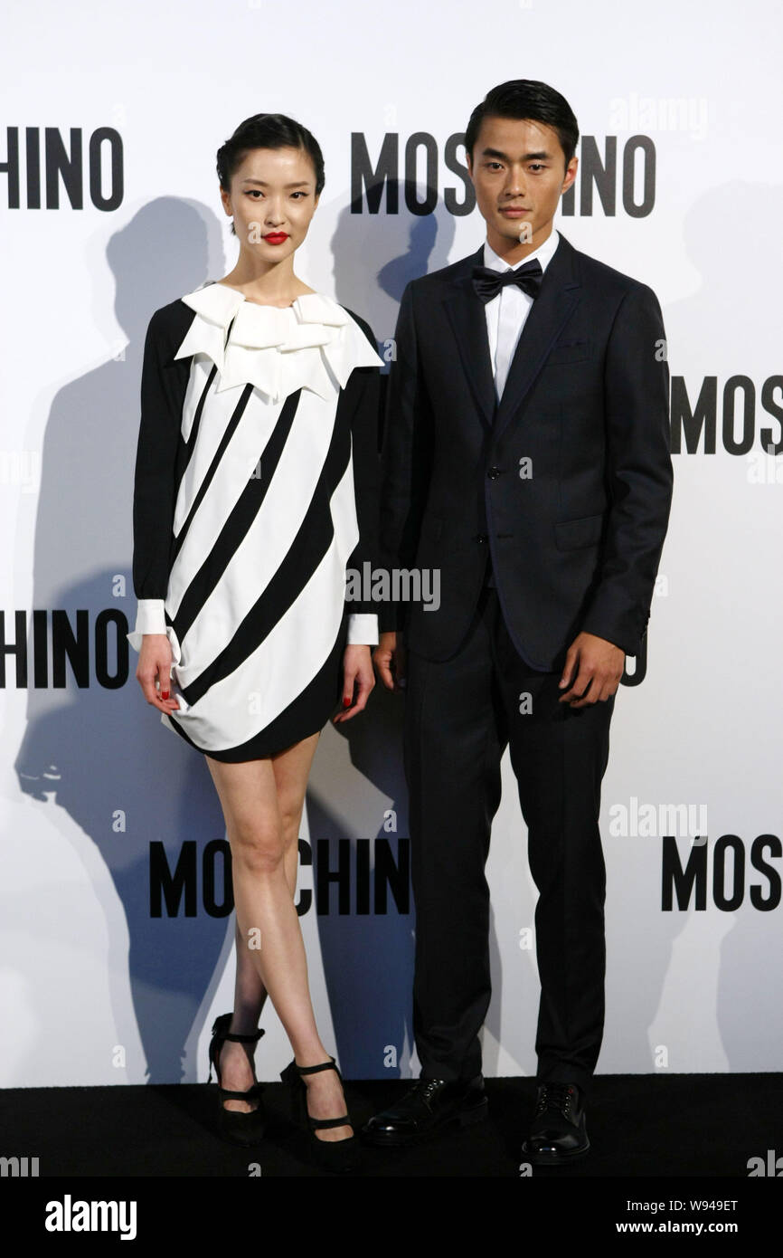 Chinese models Du Juan, left, and Zhao Lei pose as they arrive for the ...