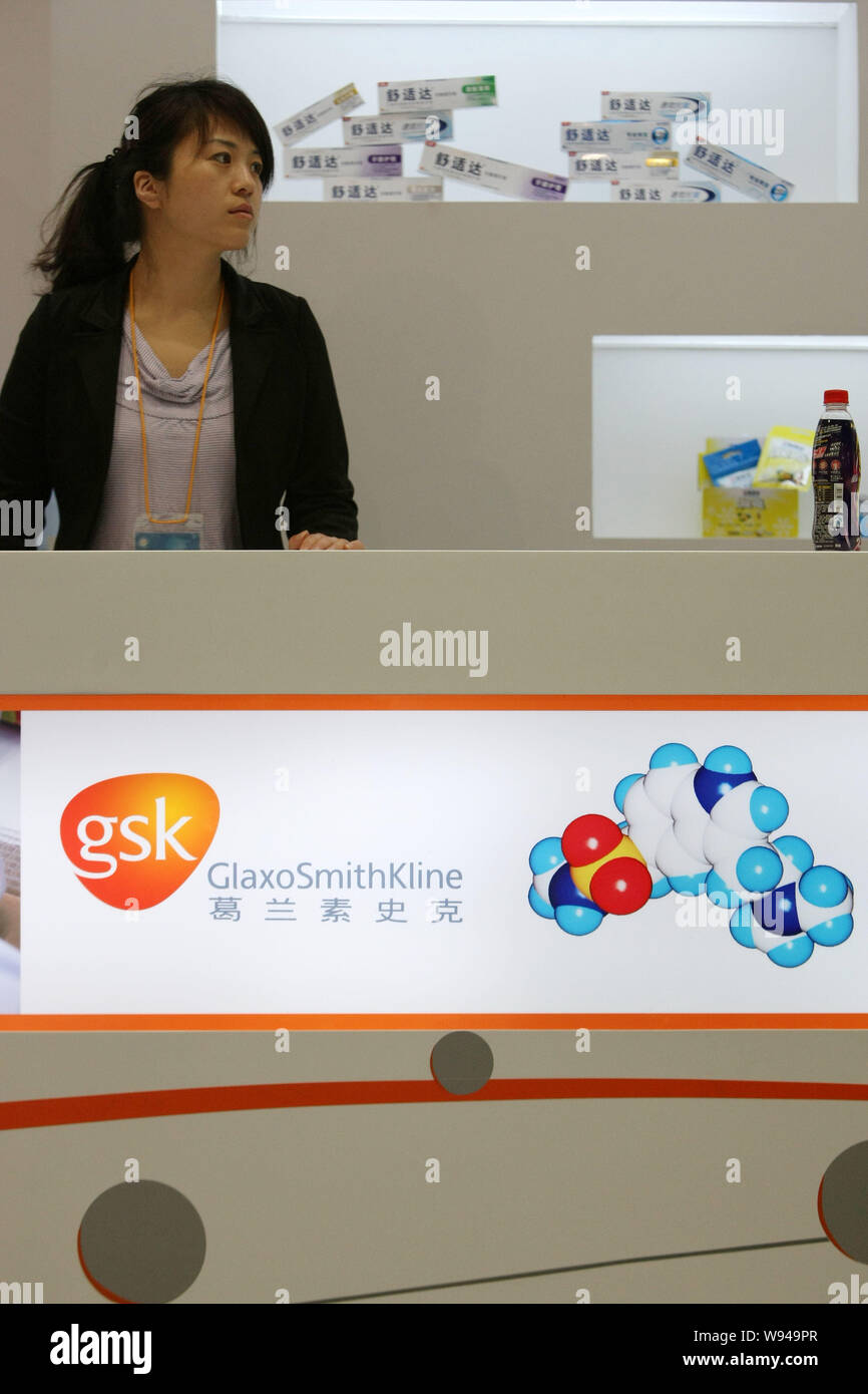 --FILE--A Chinese employee is seen at the stand of GlaxoSmithKline (GSK ...
