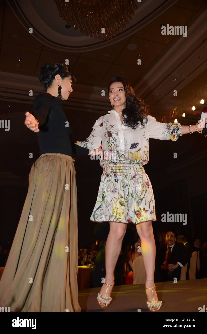 Chinese actress Li Bingbing (right) laughs during an Annual Dinner of a ...