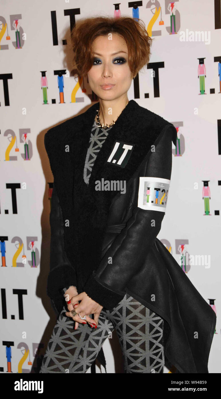 Hong Kong singer and actress Sammi Cheng poses as she arrives at the ...