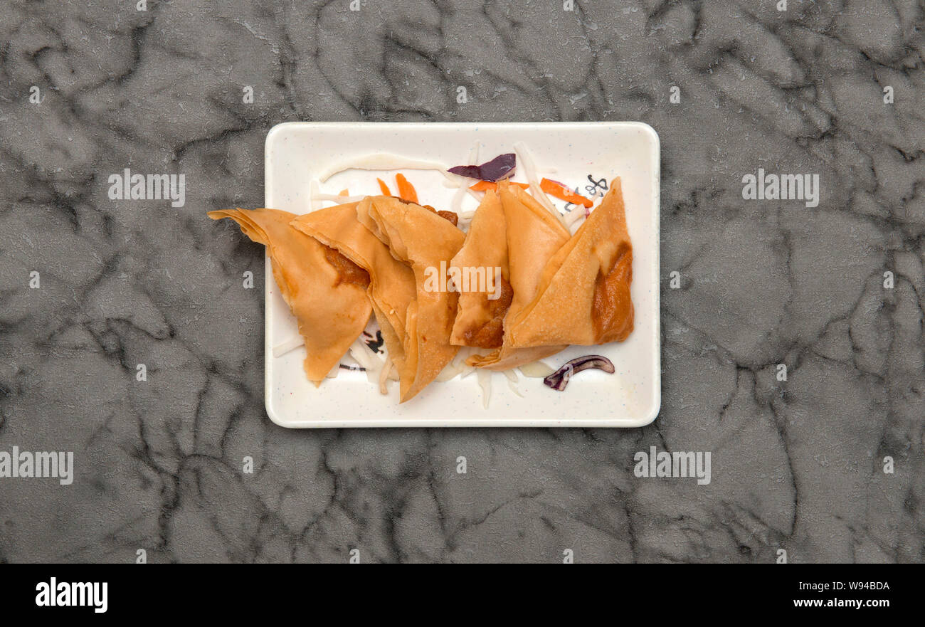 Chinese food. Curry spring rolls Stock Photo - Alamy
