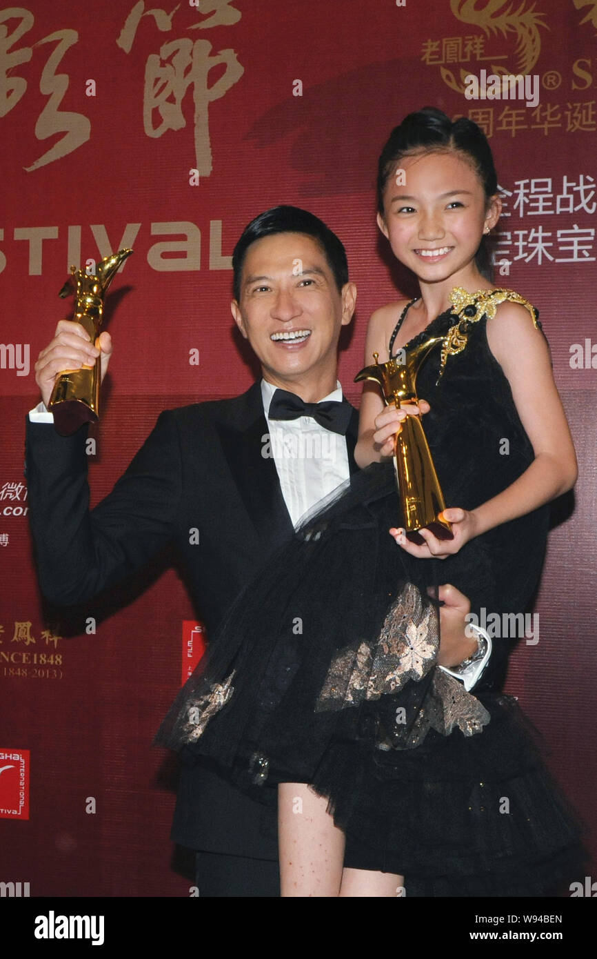 Hong Kong actor Nick Cheung Ka-fai, left, hold 10-year-old Malaysian ...