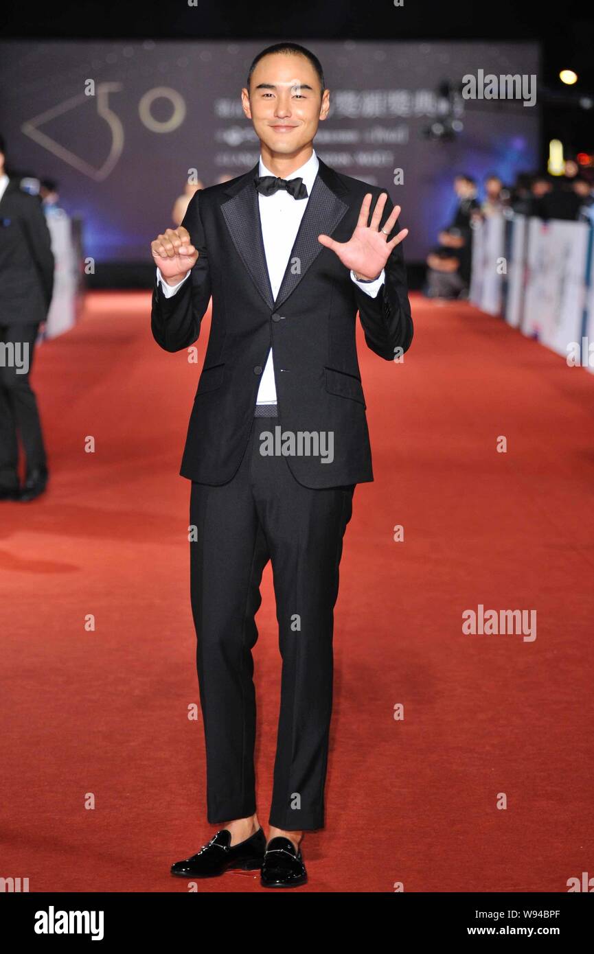 Taiwanese actor Eddie Peng waves on the red carpet as he arrives at the ...