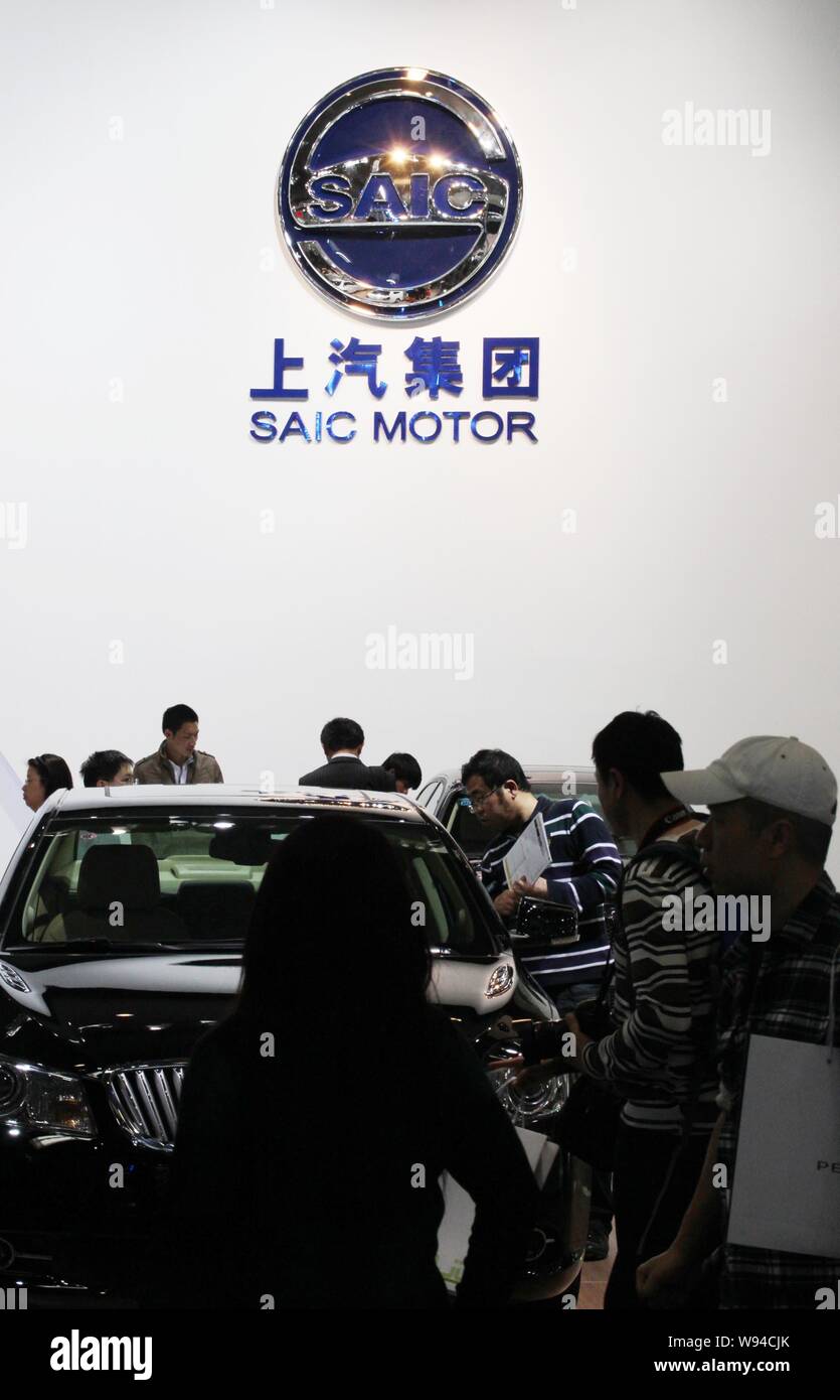 --FILE--Visitors view cars at the stand of SAIC Motor during the 12th ...
