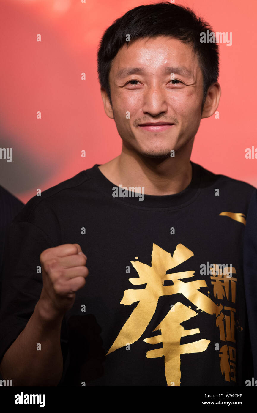 Chinese Olympic boxing champion Zou Shiming poses at a press conference ...