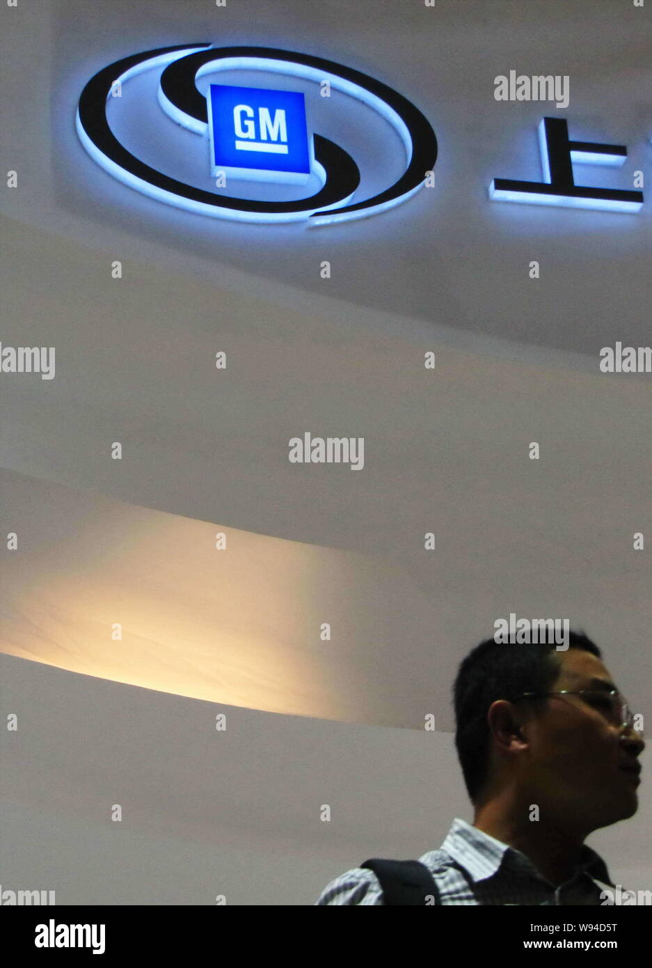 --FILE--A Chinese man visits the stand of Shanghai GM, a joint venture ...