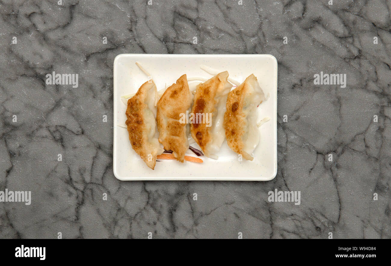 Chinese food. Pan fried chicken dumplings Stock Photo - Alamy