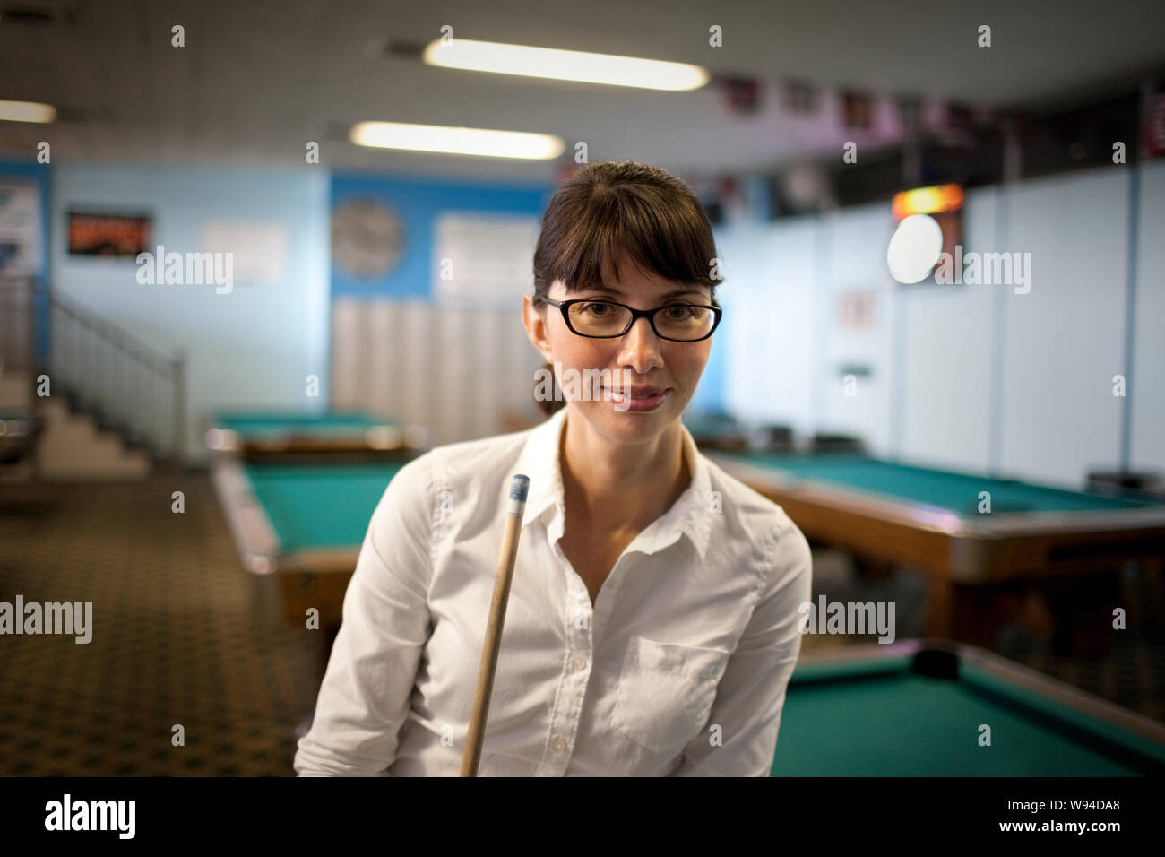 Woman holding pool cue hi-res stock photography and images - Alamy