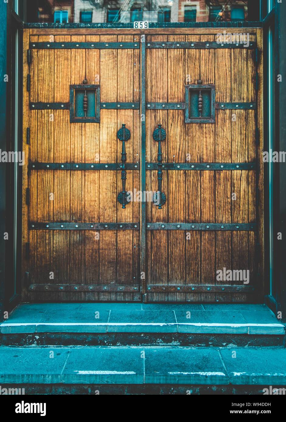 Vertical shot of a brown wooden door Stock Photo - Alamy