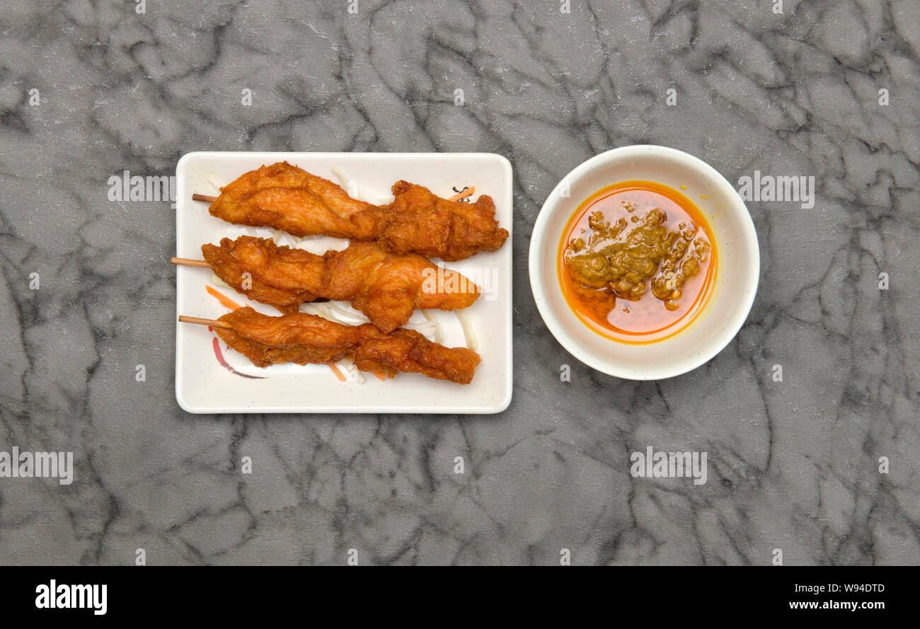 Chinese food. Satay chicken on skewers Stock Photo - Alamy