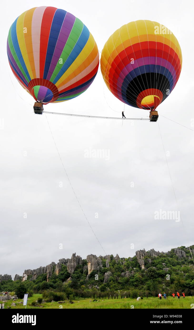 Chinese Uighur tightrope walker Aisikaier Wubulikaisimu walks on a ...