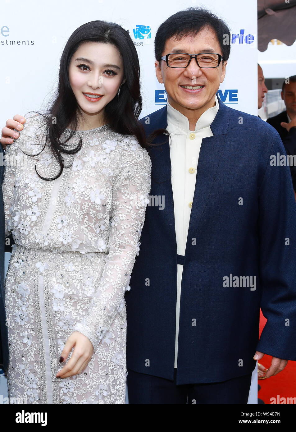 Hong Kong kungfu superstar Jackie Chan, right, poses with Chinese ...
