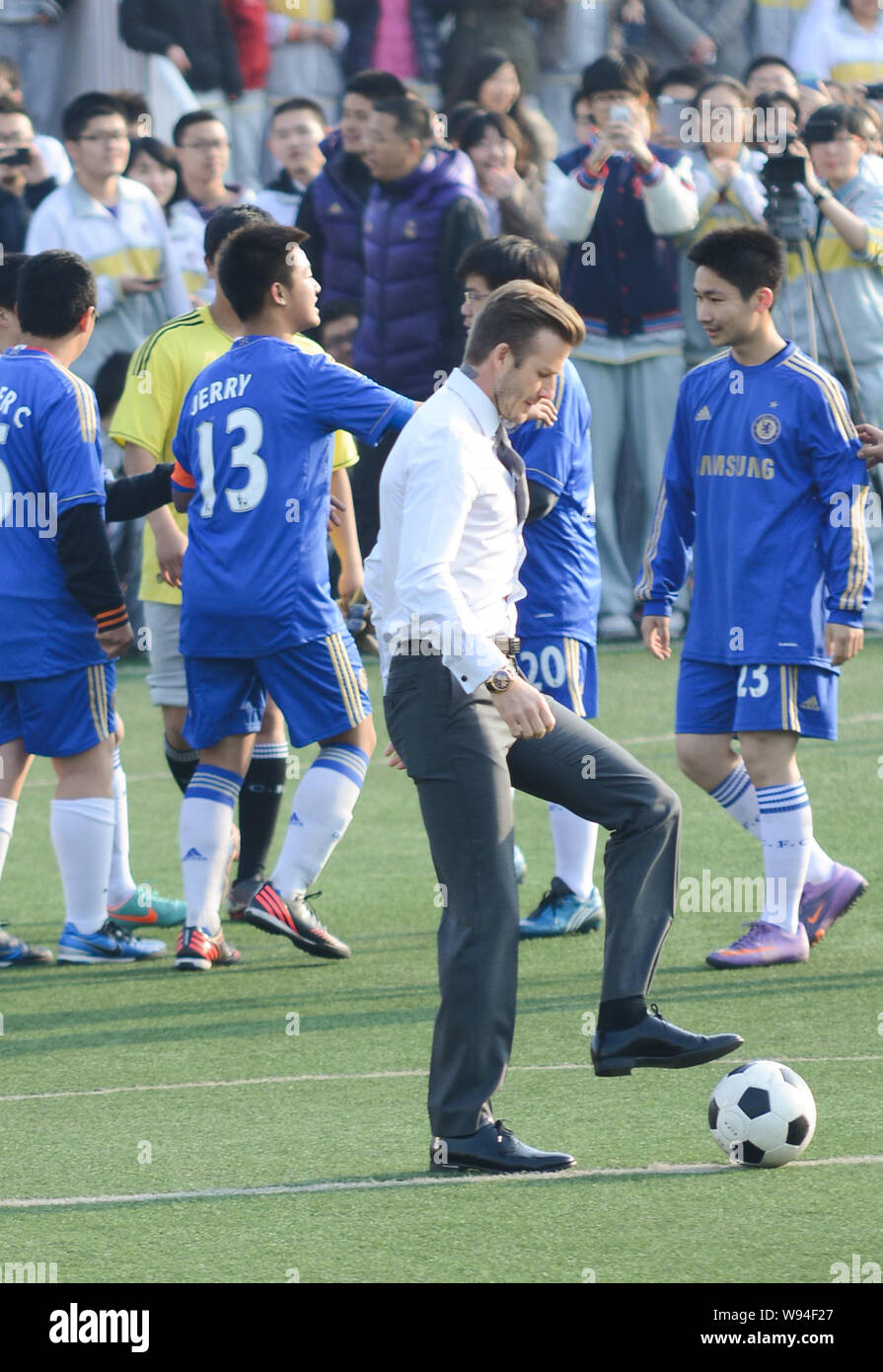 English football superstar David Beckham, front, plays football with ...