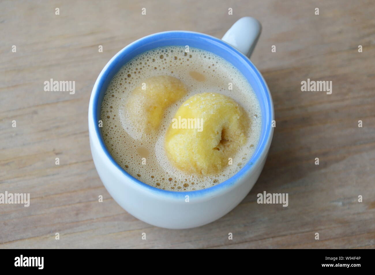mini donuts floating in coffee Stock Photo - Alamy