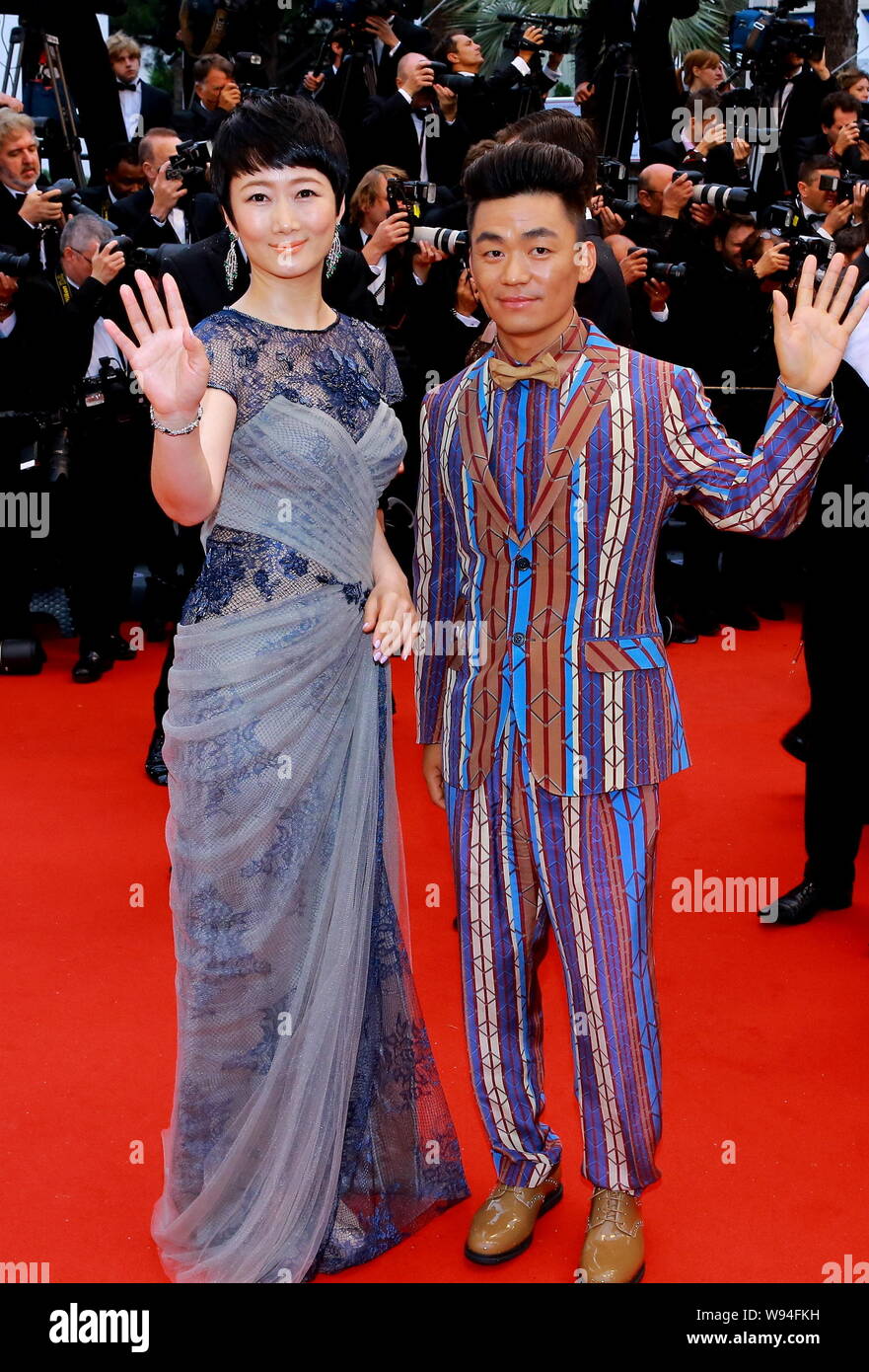 Chinese actress Zhao Tao, left, and actor Wang Baoqiang wave on the red ...