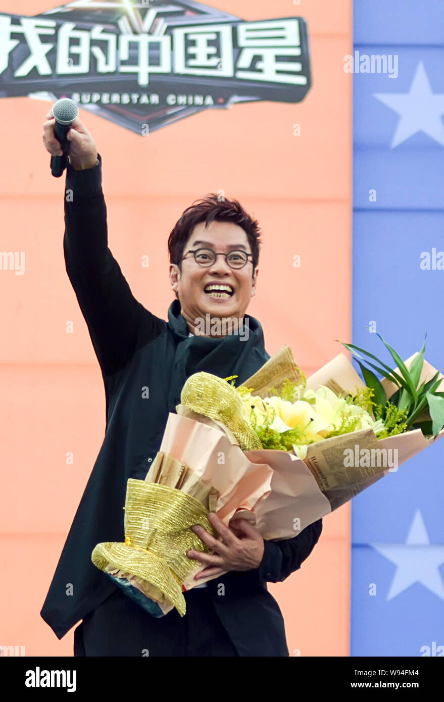 Hong Kong singer and actor Alan Tam performs at the launch ceremony of ...