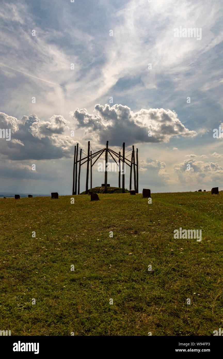 flower monument made from wood, on blue sky Stock Photo - Alamy