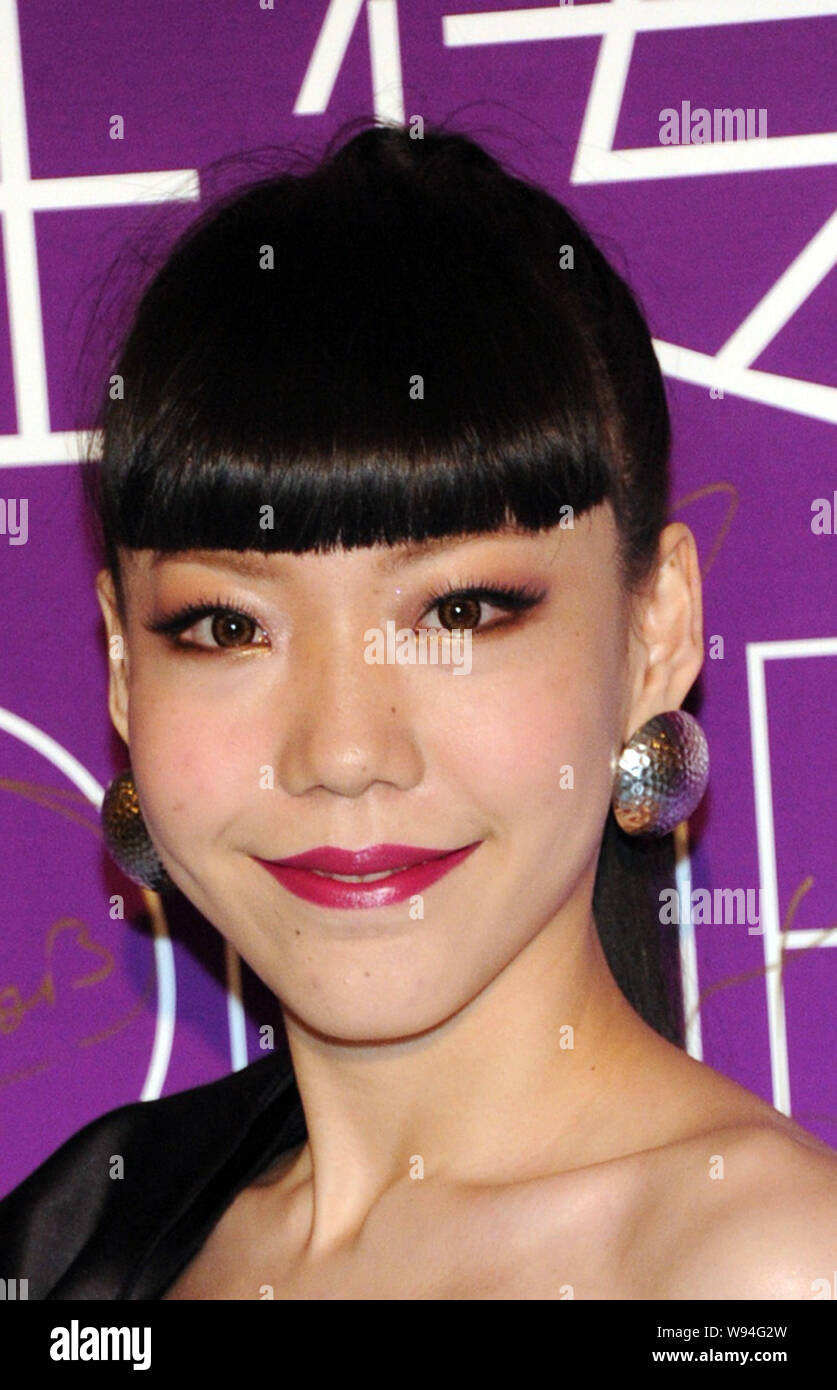 Chinese singer Wu Mochou poses as she arrives for the 3rd Women Media ...