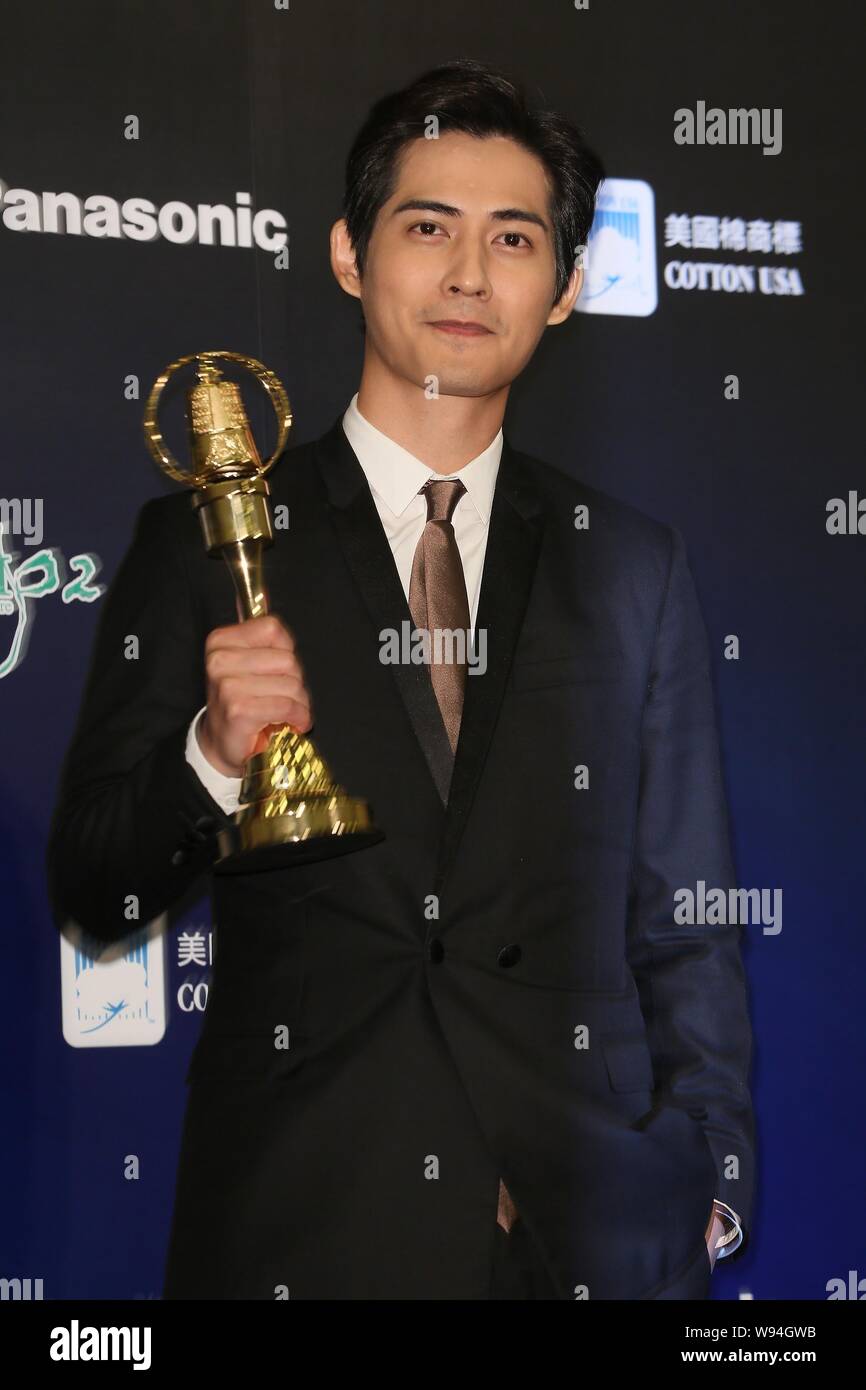 Taiwanese actor Vic Chou poses with the trophy after winning the Best ...