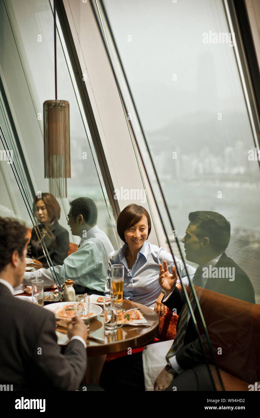 Business colleagues socializing at a restaurant Stock Photo - Alamy