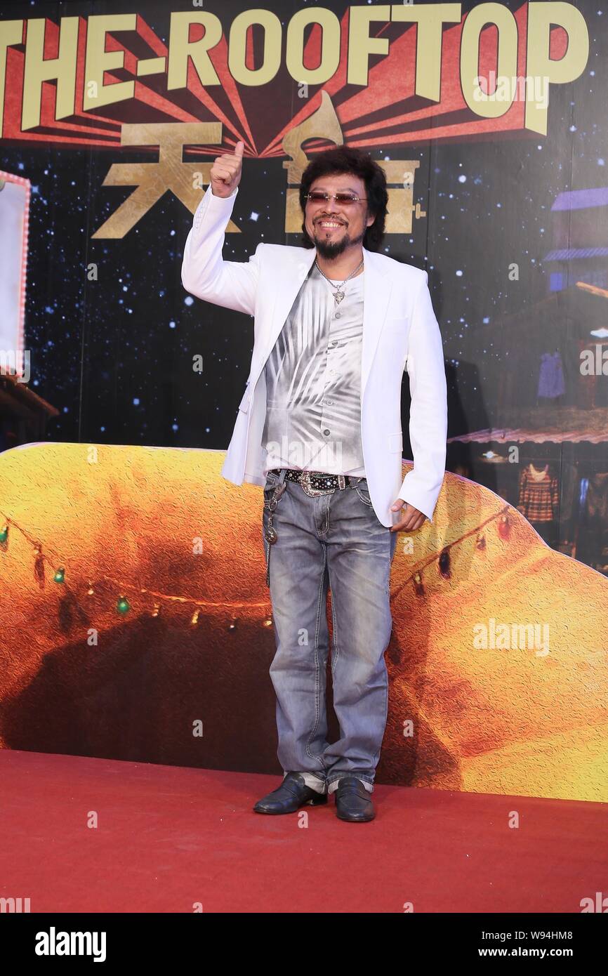 Taiwanese star host Fei Chang poses as he arrives at the premiere for ...