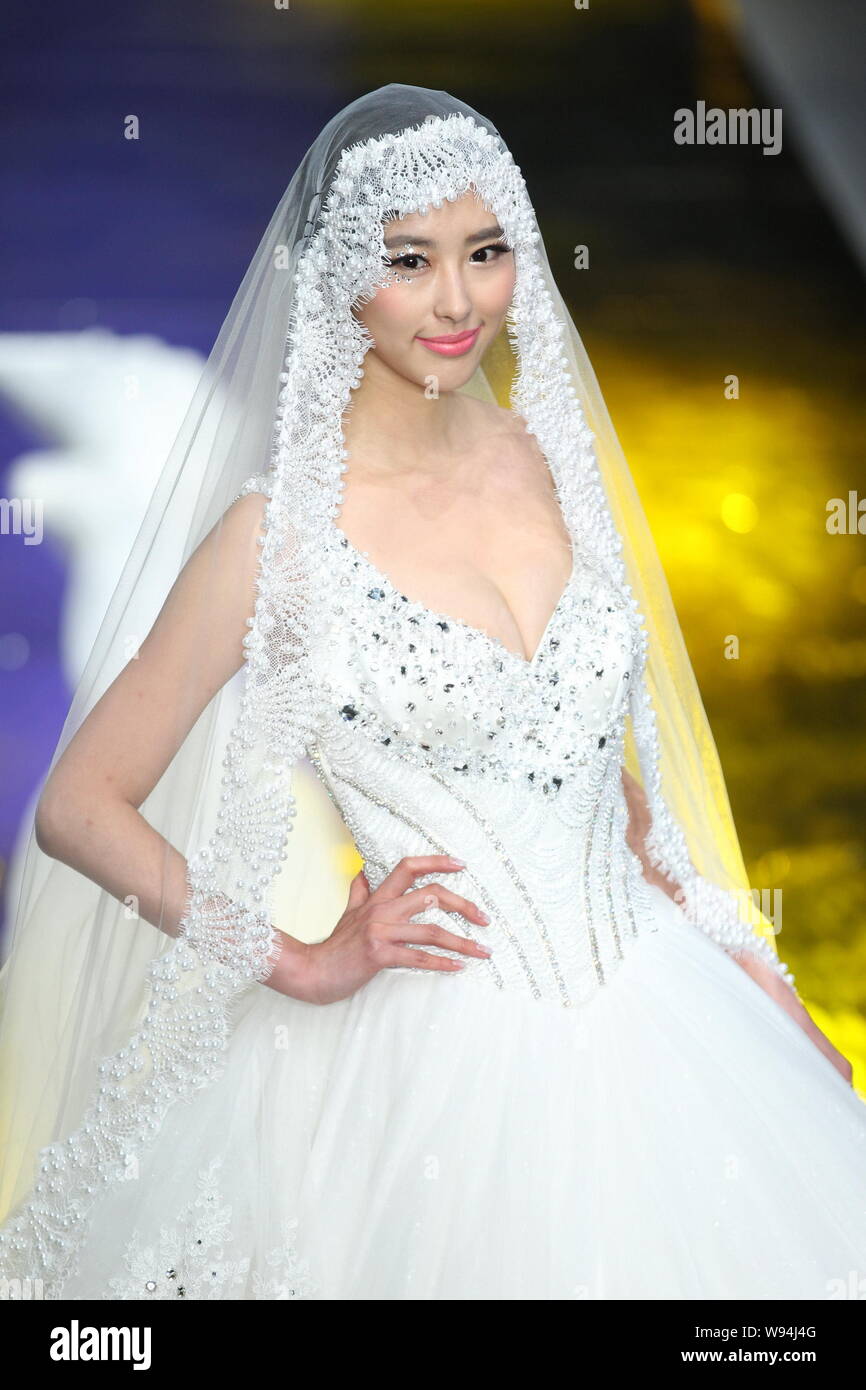 Chinese model Zhai Ling displays a new creation by Chinese fashion designer Mark Cheung in the ...