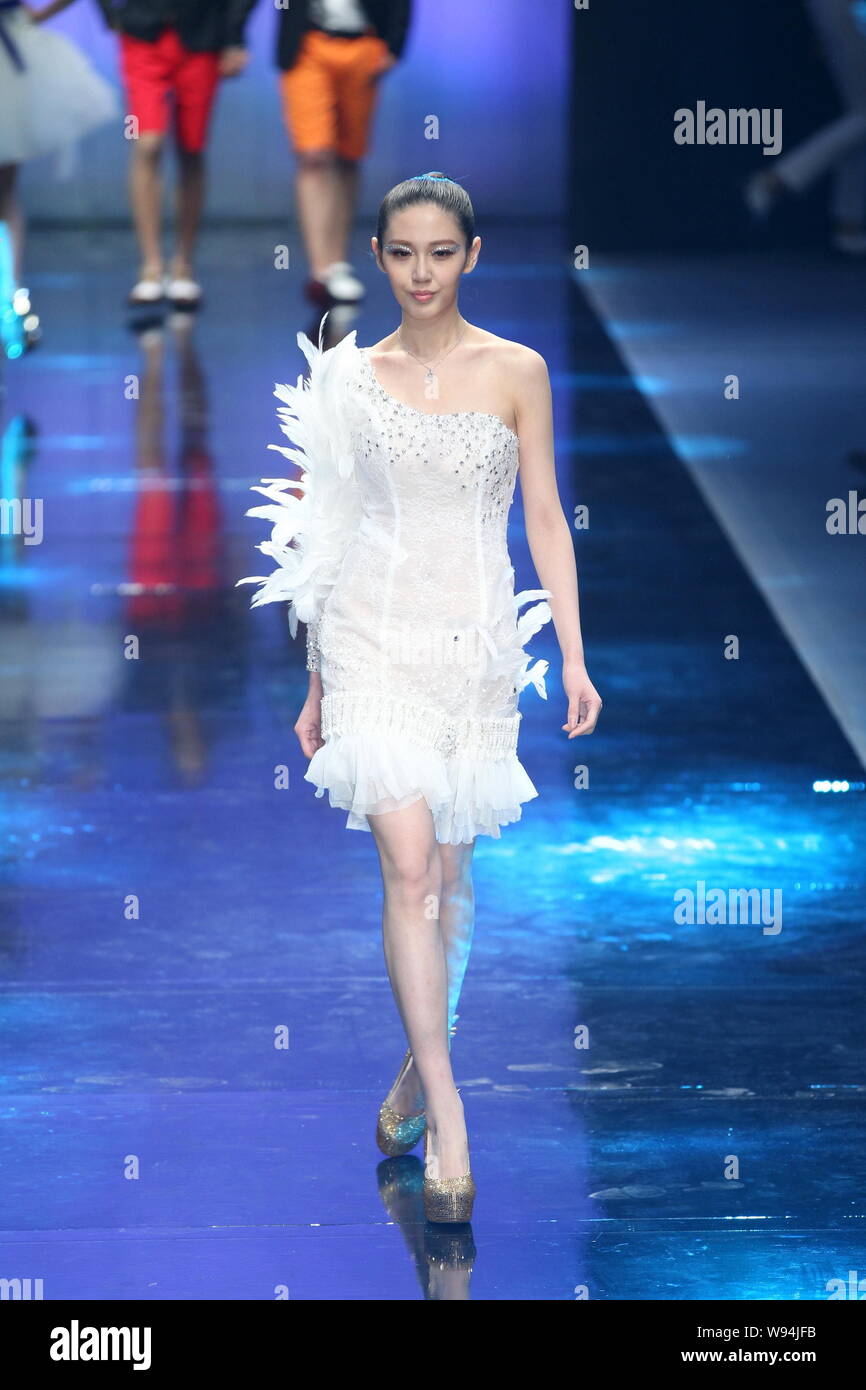 A model displays a new creation by Chinese fashion designer Mark Cheung ...