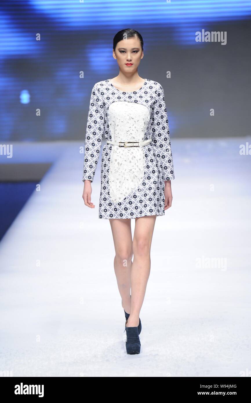 A model displays a new creation by Chinese fashion designer Yuan Bing ...