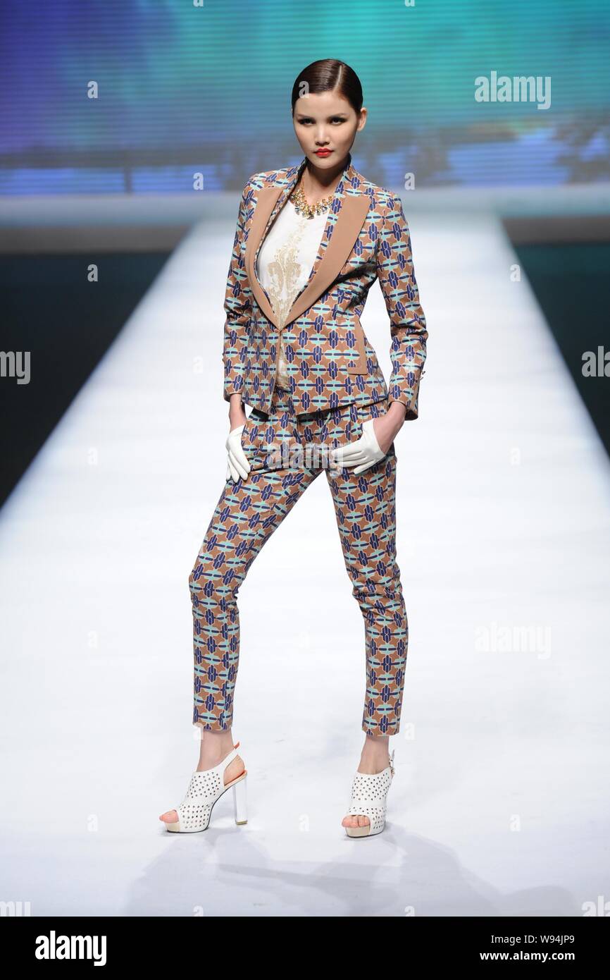 Chinese model Mo Wandan displays a new creation by Chinese fashion ...