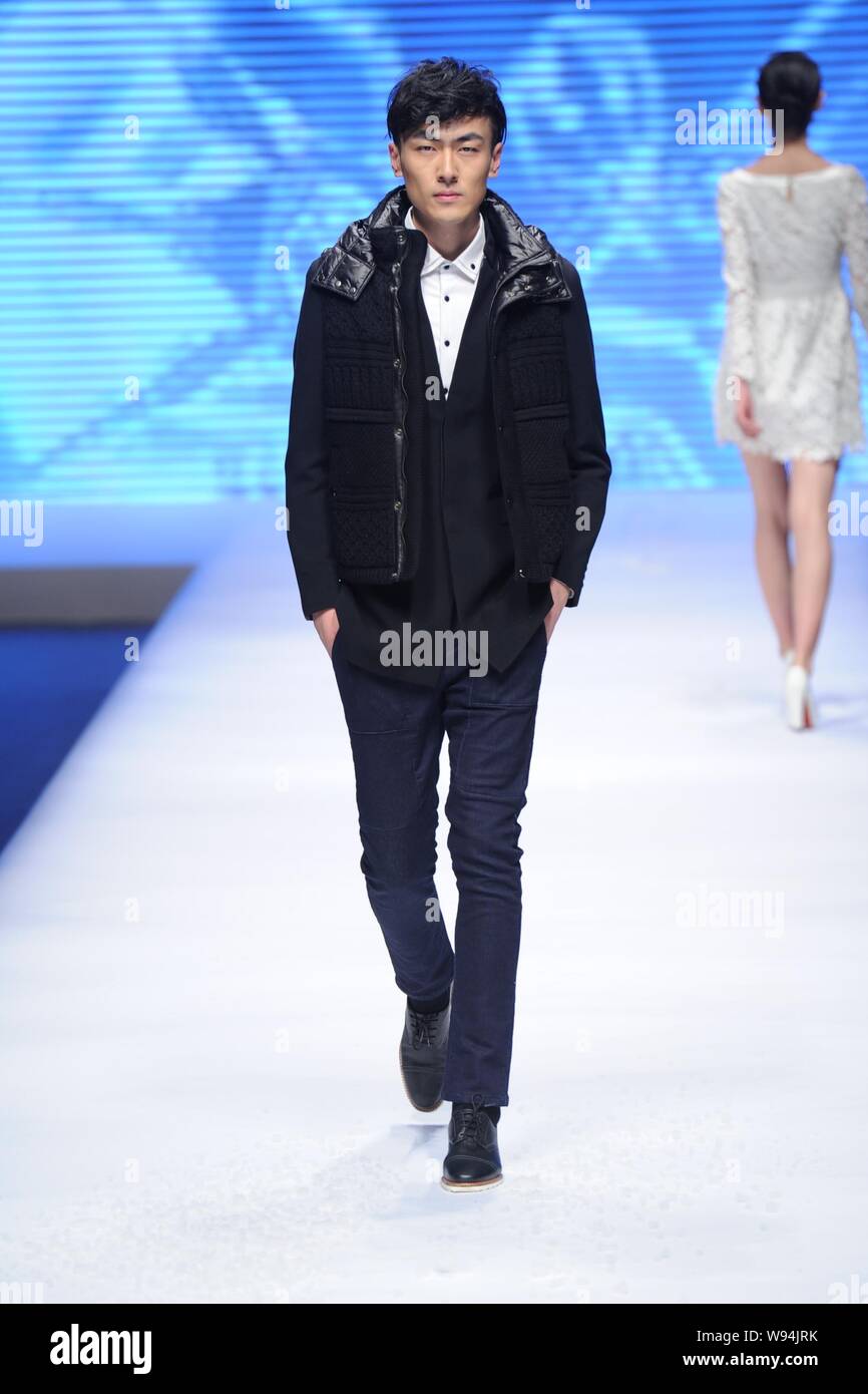 A model displays a new creation by Chinese fashion designer Yuan Bing ...