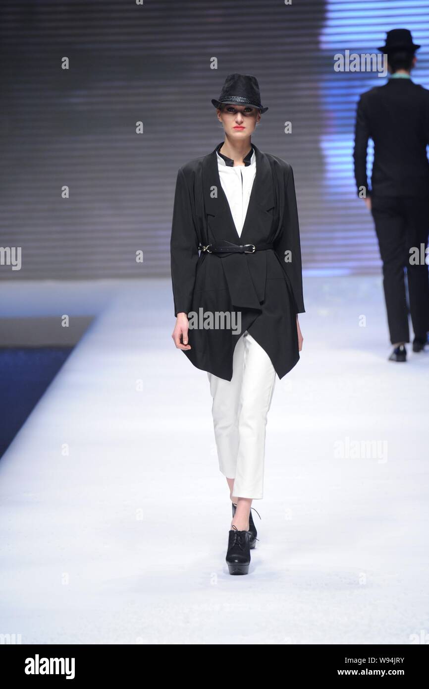 A model displays a new creation by Chinese fashion designer Yuan Bing ...