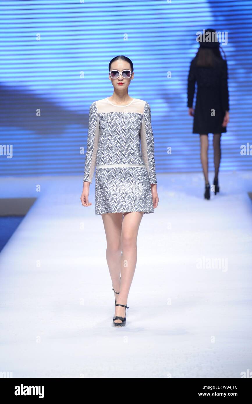 A model displays a new creation by Chinese fashion designer Yuan Bing ...