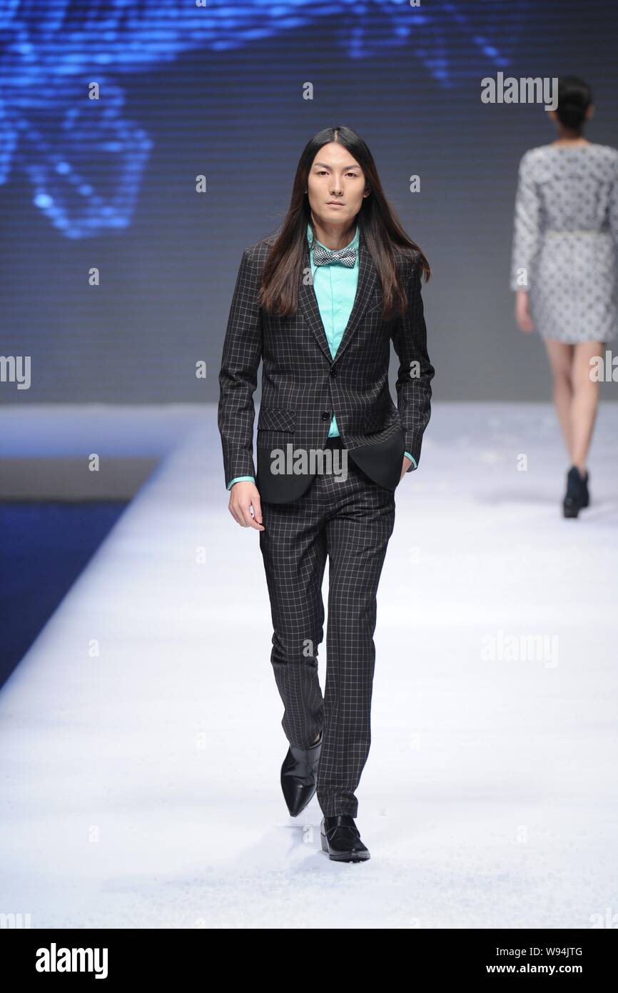 A model displays a new creation by Chinese fashion designer Yuan Bing ...